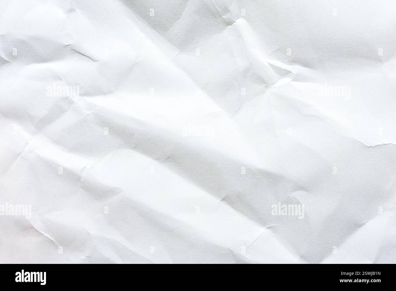 Crumpled white paper texture with folds and creases for background or ...