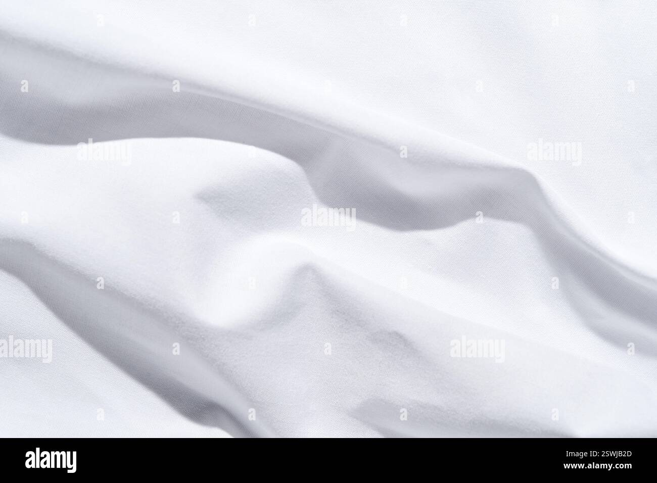 Smooth white fabric with soft folds and gentle shadows creating a subtle textured surface Stock ...