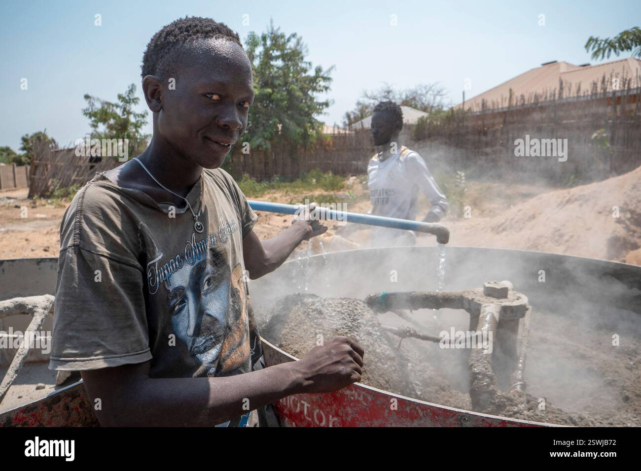Workers at a cement blocks production workshop in the Rock City area in ...