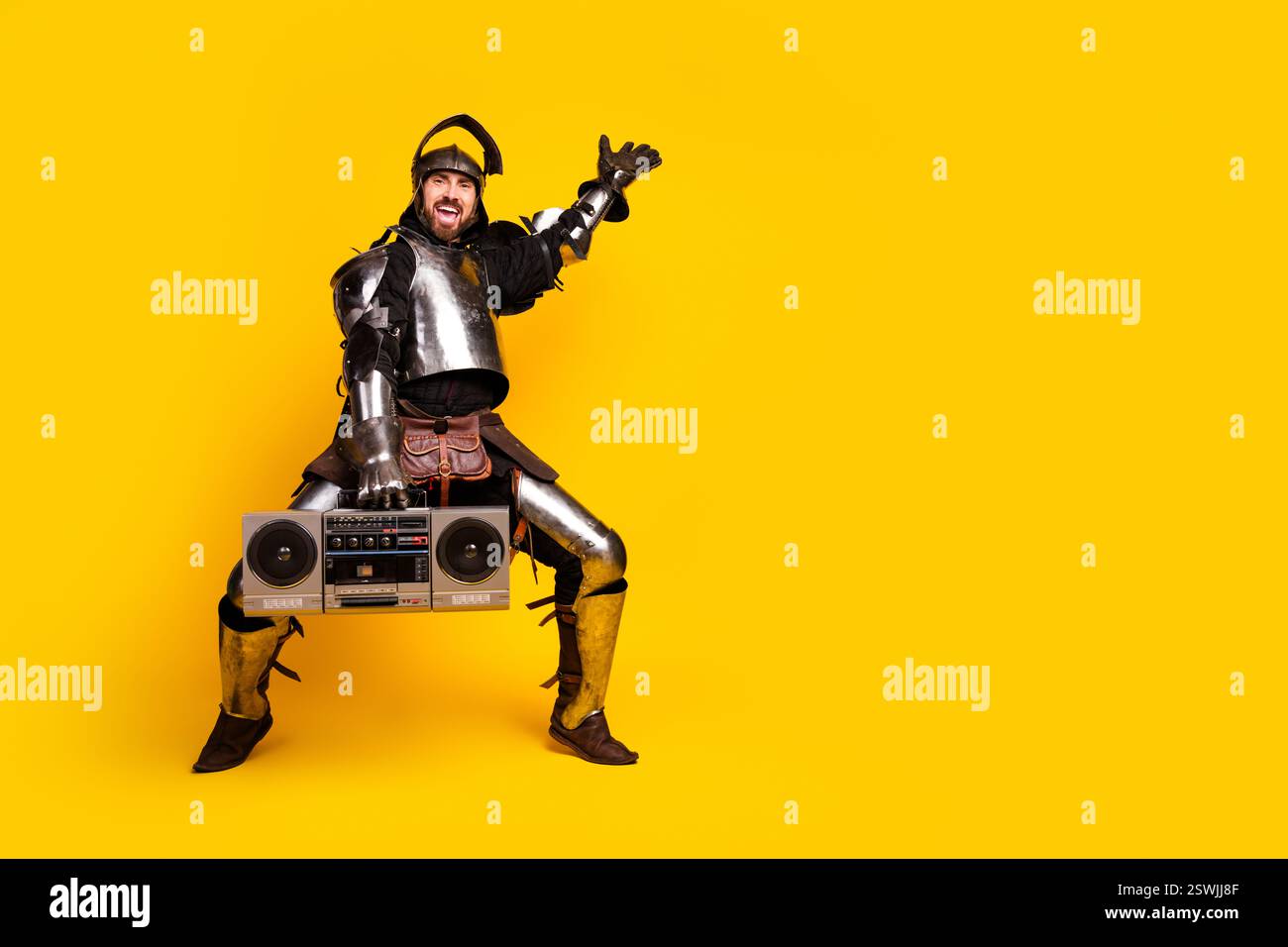 A knight in antique armor posing with a boombox on a vibrant yellow ...