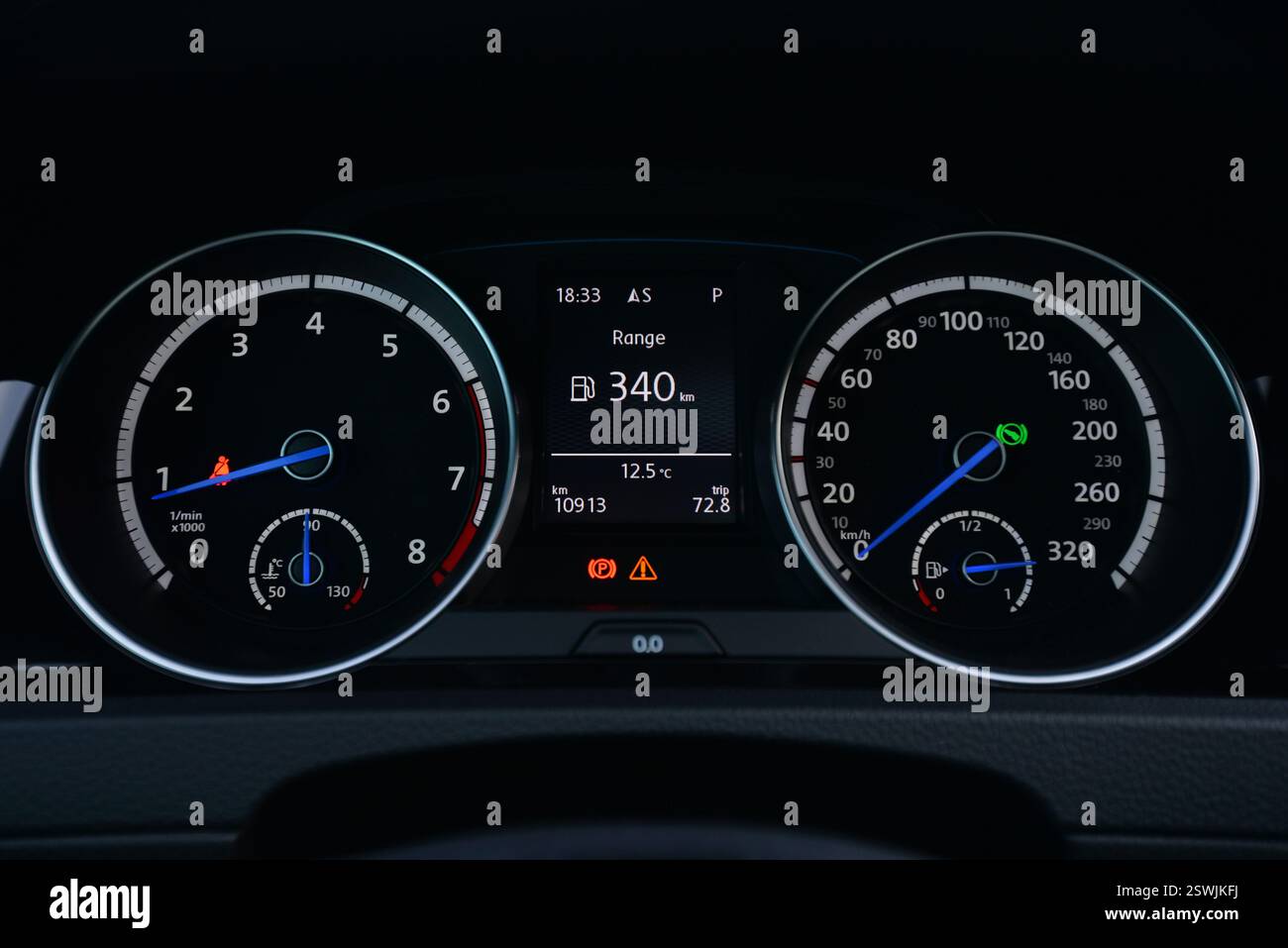 Close up view of a car's instrument panel showing the speedometer ...