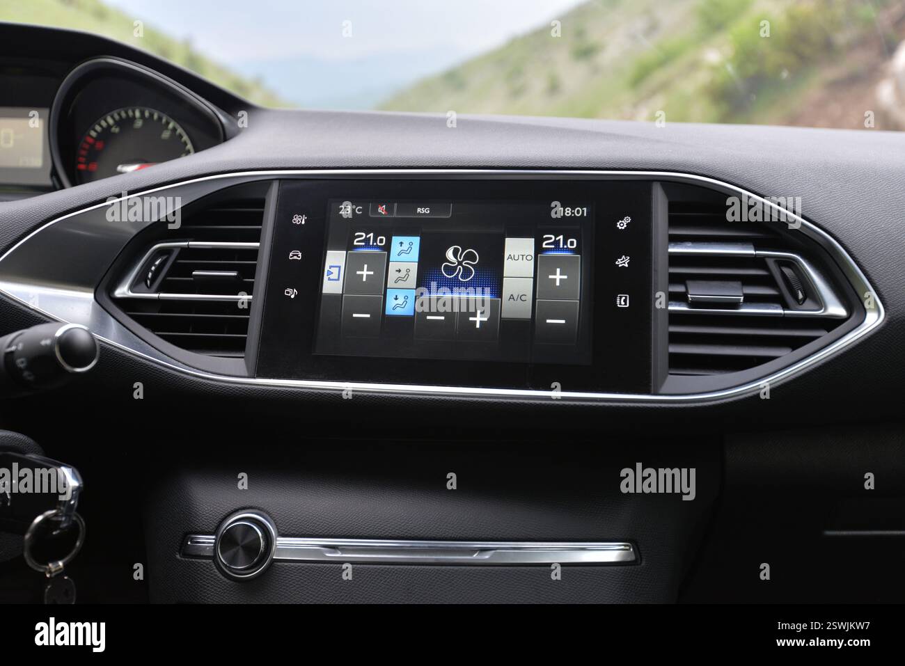 Modern car interior detail: climate control and infotainment screen ...