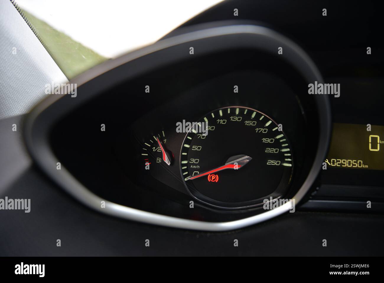 Close up of a car's dashboard with speedometer fuel gauge and odometer ...