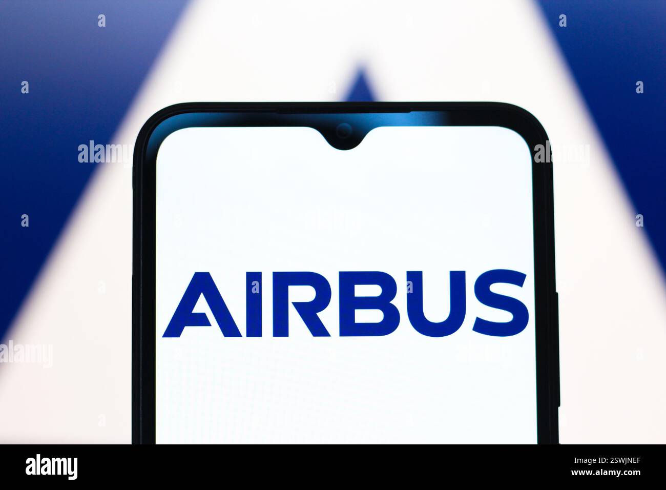 In this photo illustration, the Airbus logo is seen displayed on a ...