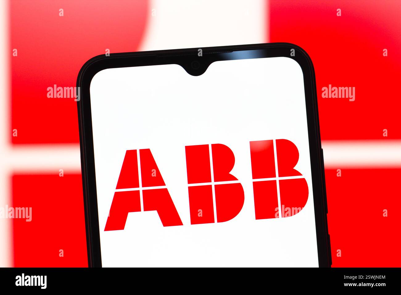 In this photo illustration, the ABB logo is seen displayed on a ...