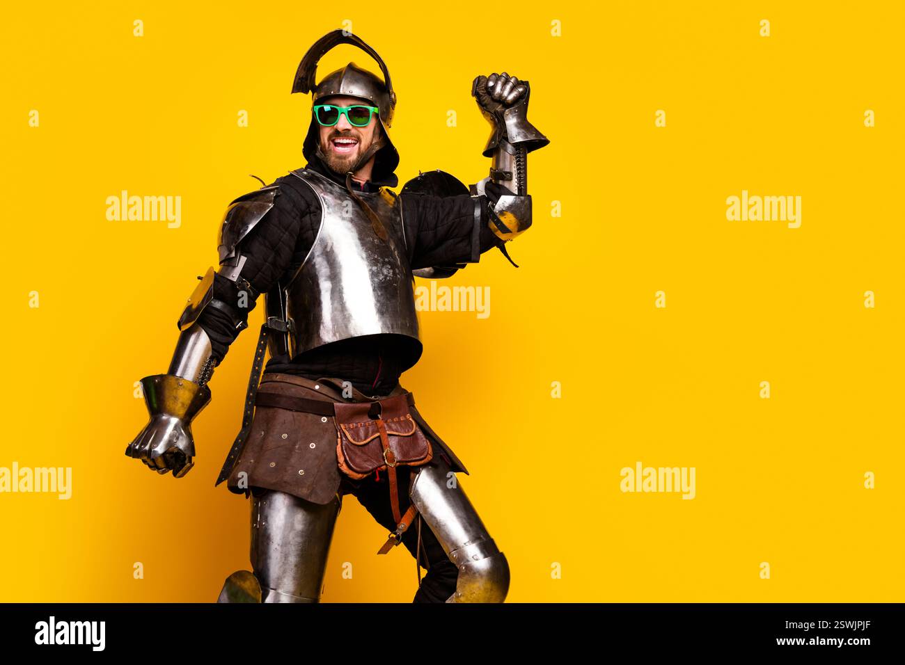 Armored man mixing medieval and modern styles with bright sunglasses on ...