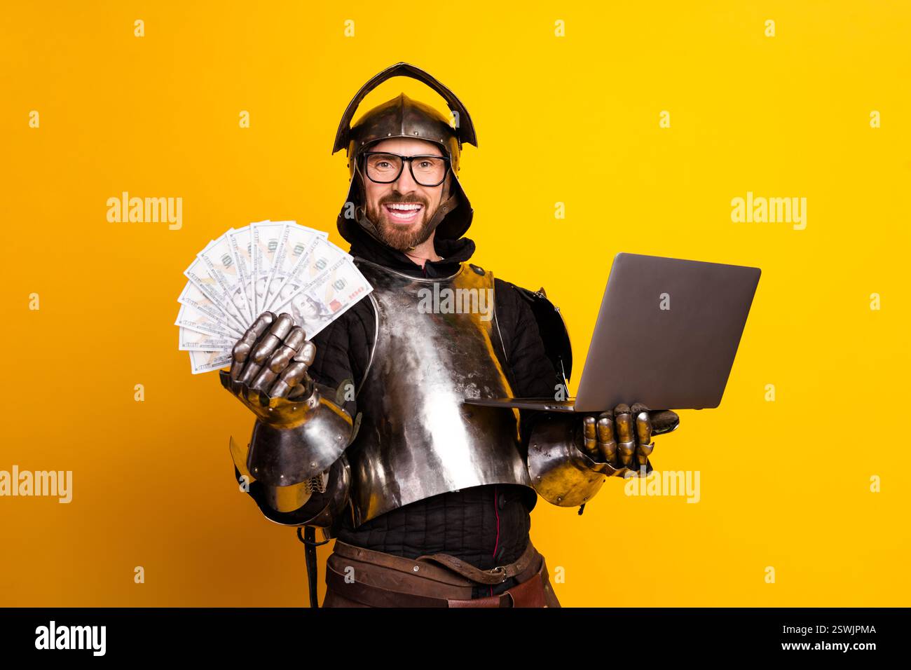 Man in Medieval Armor Holding Money and Laptop on Yellow Background ...