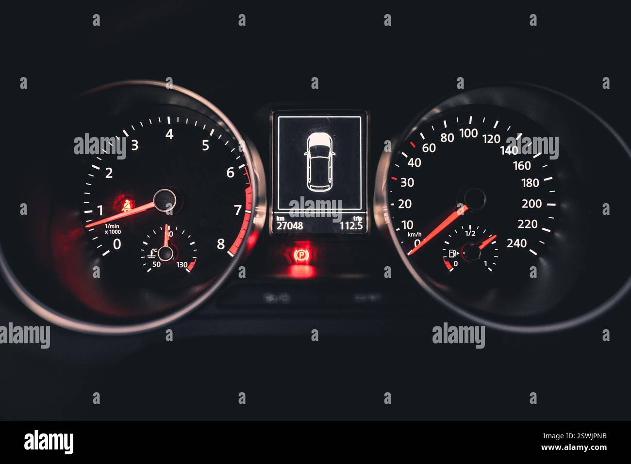 Close up of a car's dashboard at night showing the speedometer ...