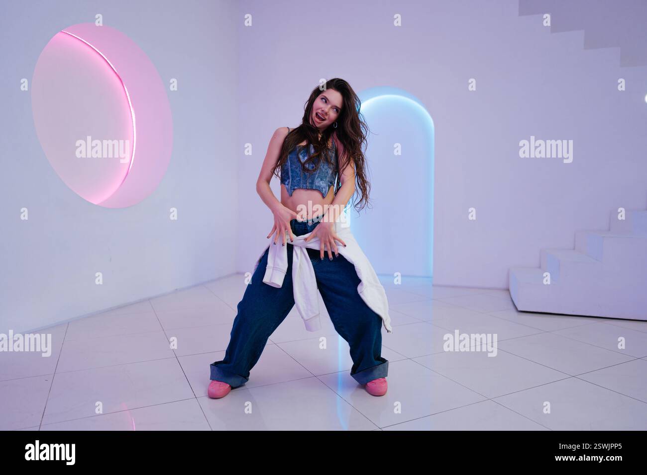 Young dancer performs dynamic routine in stylish studio setting Stock ...