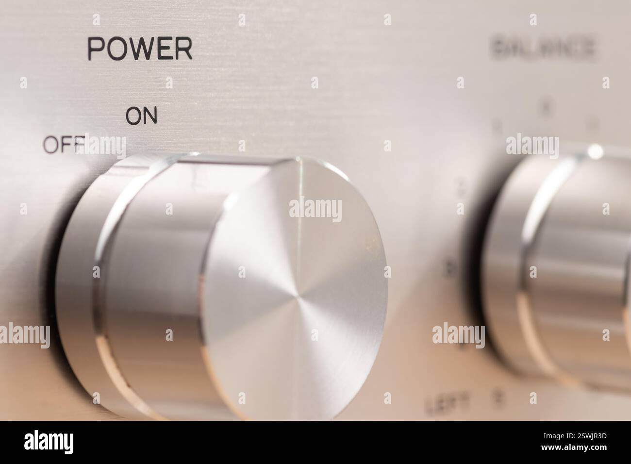 Detailed close-up view of a stereo system's power and balance knob ...