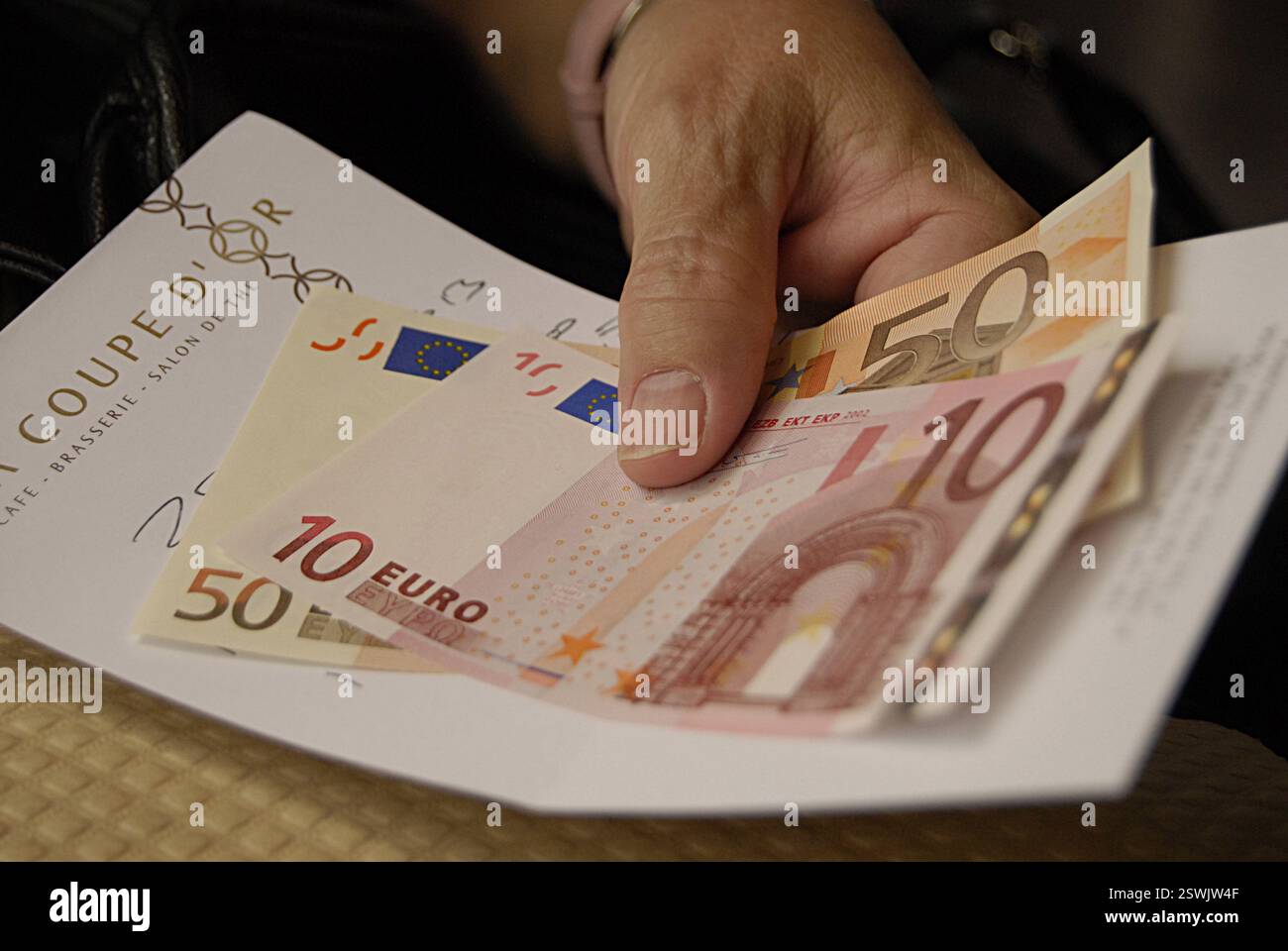 PARIS/FRANCE Paying restaurant bill with euros 25 July 2013 (Photo by ...