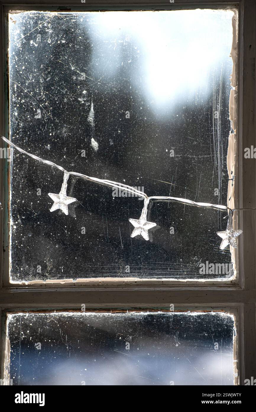 Stars in the window Stock Photo - Alamy