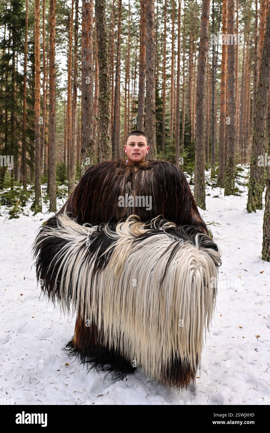 Traditional Kukeri performers dressed in thick long hair goat fur ...