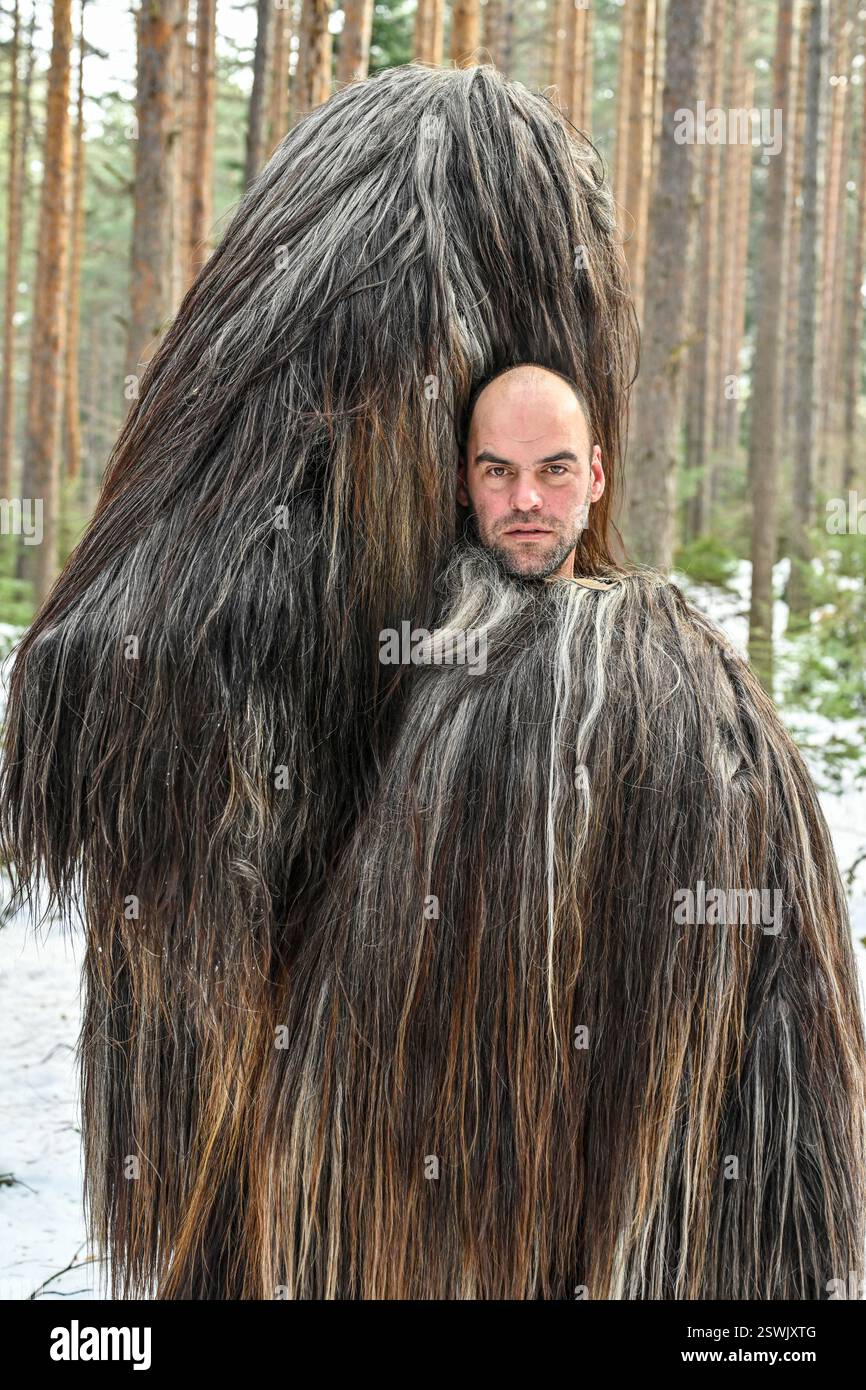 Traditional Kukeri performers dressed in thick long hair goat fur ...