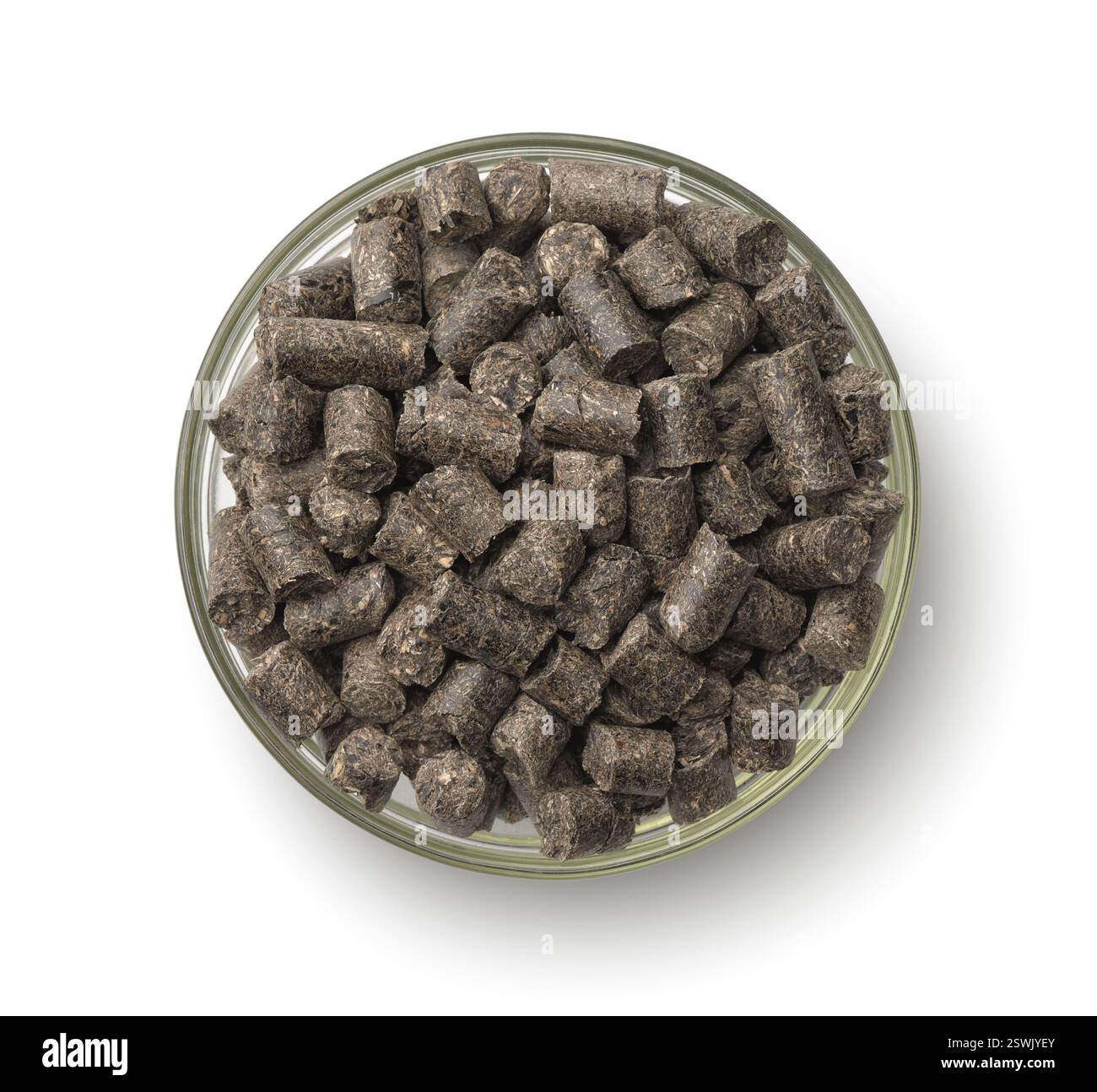 Top view of sunflower press cake pellets in glass bowl isolated on ...