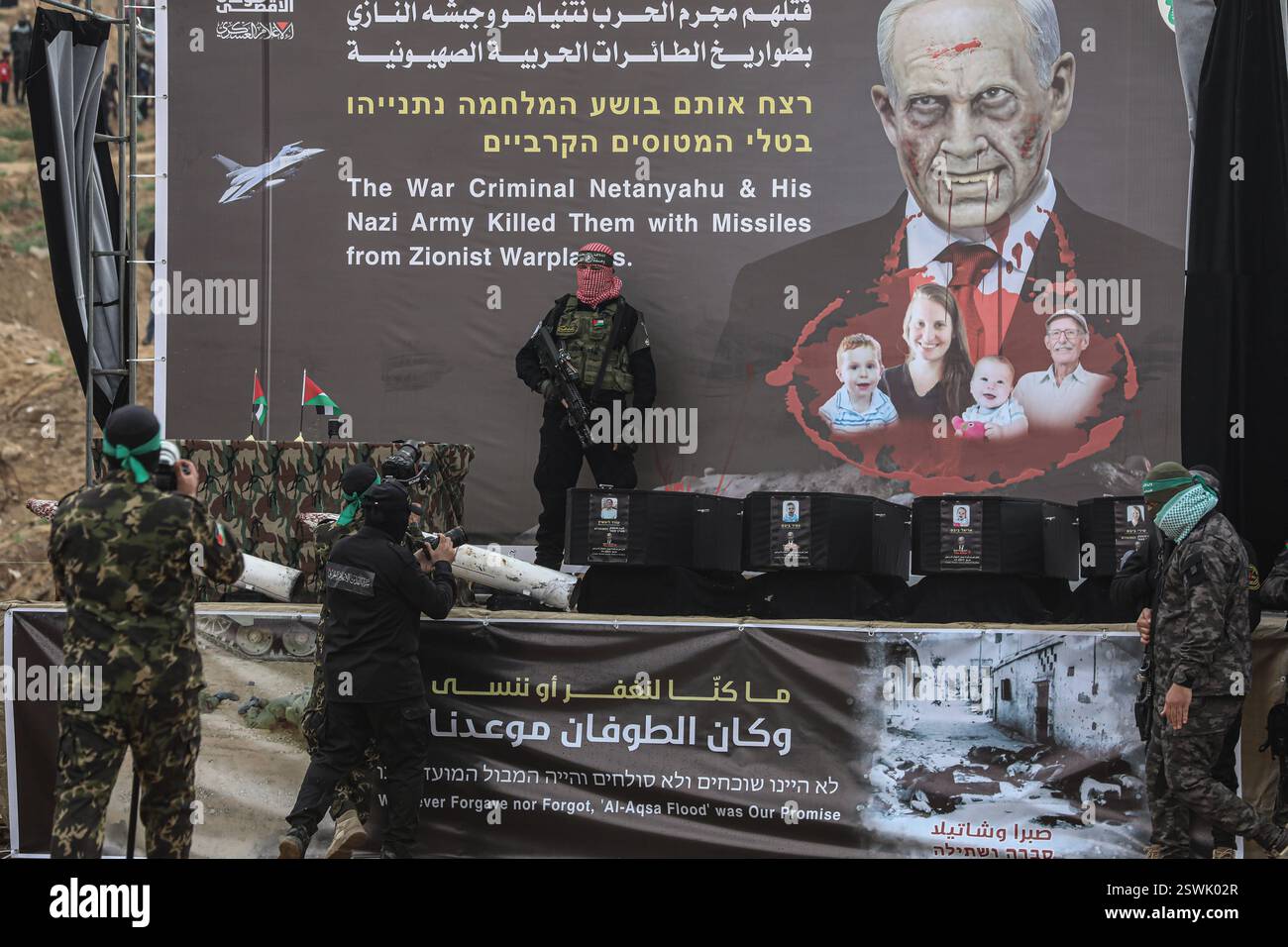 Members of the Al-Qassam Brigades, the military wing of Hamas, hand ...