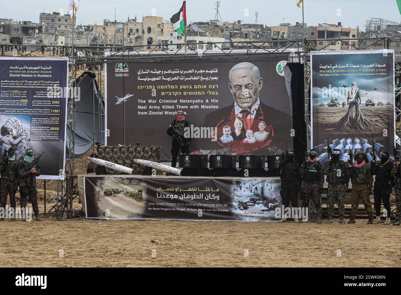 Members of the Al-Qassam Brigades, the military wing of Hamas, hand ...