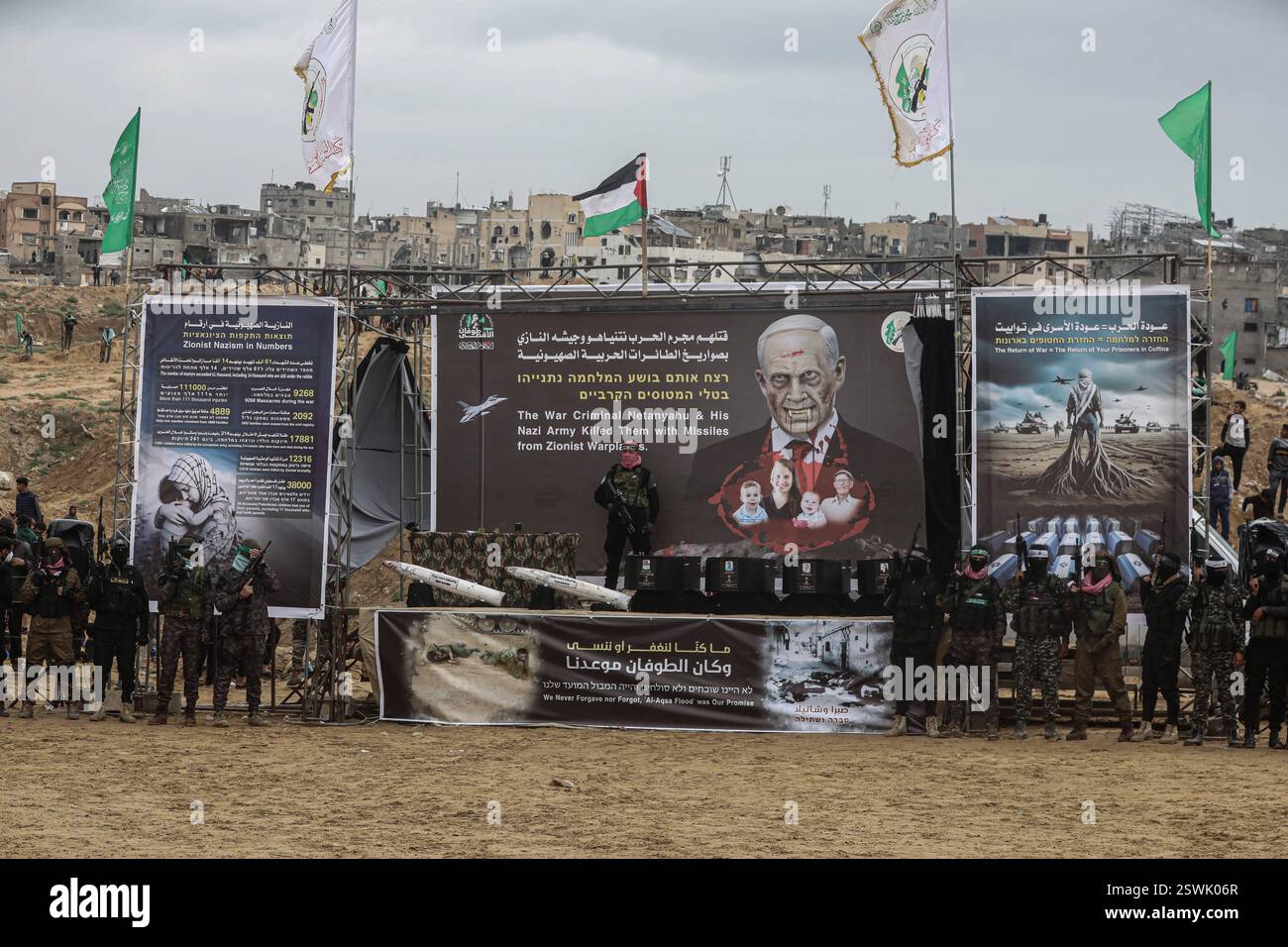 Members of the Al-Qassam Brigades, the military wing of Hamas, hand ...