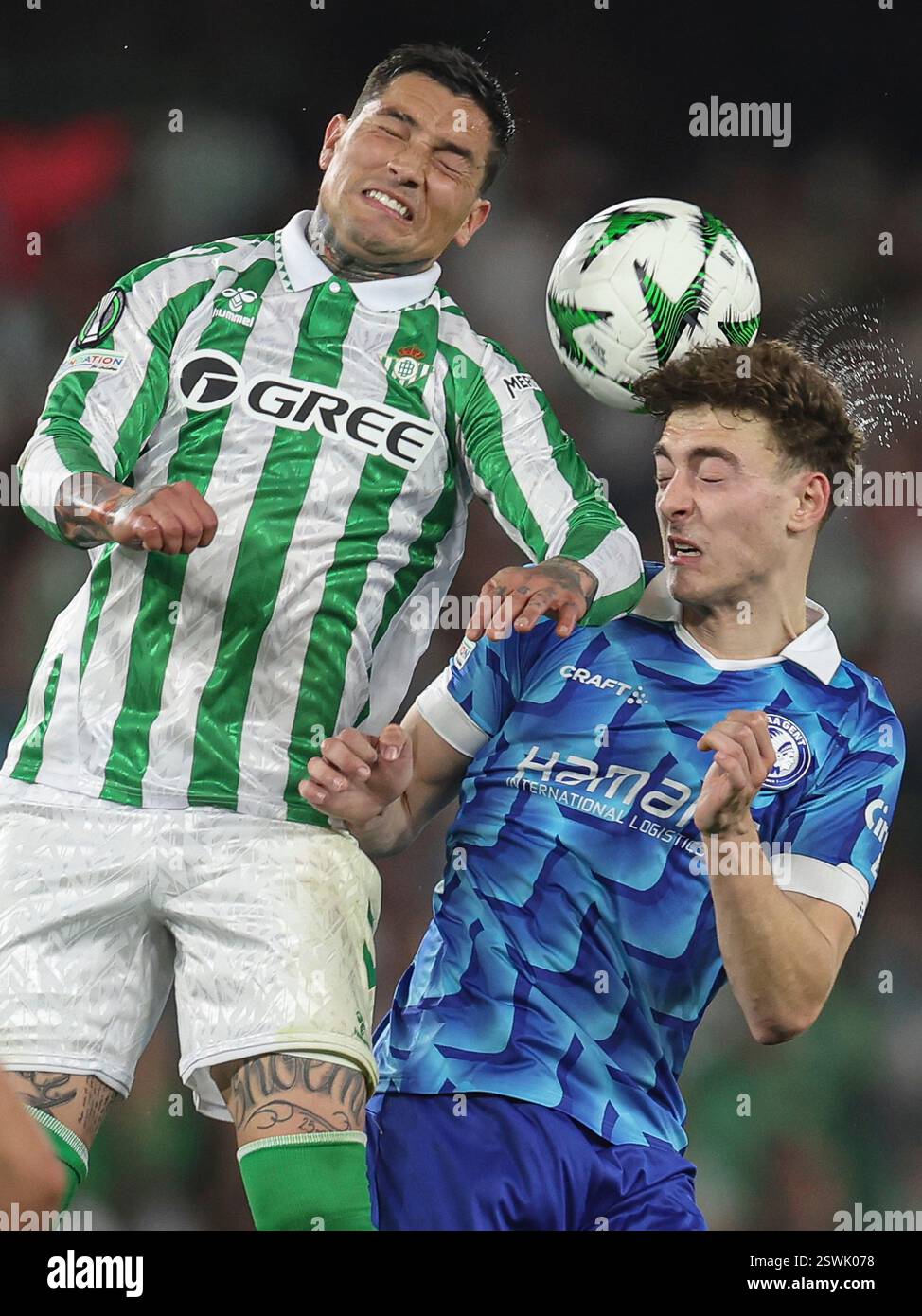 Chimy Avila of Real Betis and Mathias Delorge of KAA Gent during the ...