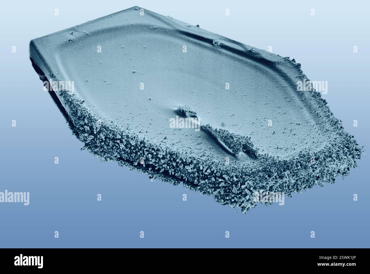 Rimed hexagonal snow crystal. Rime is a white ice that forms when the ...