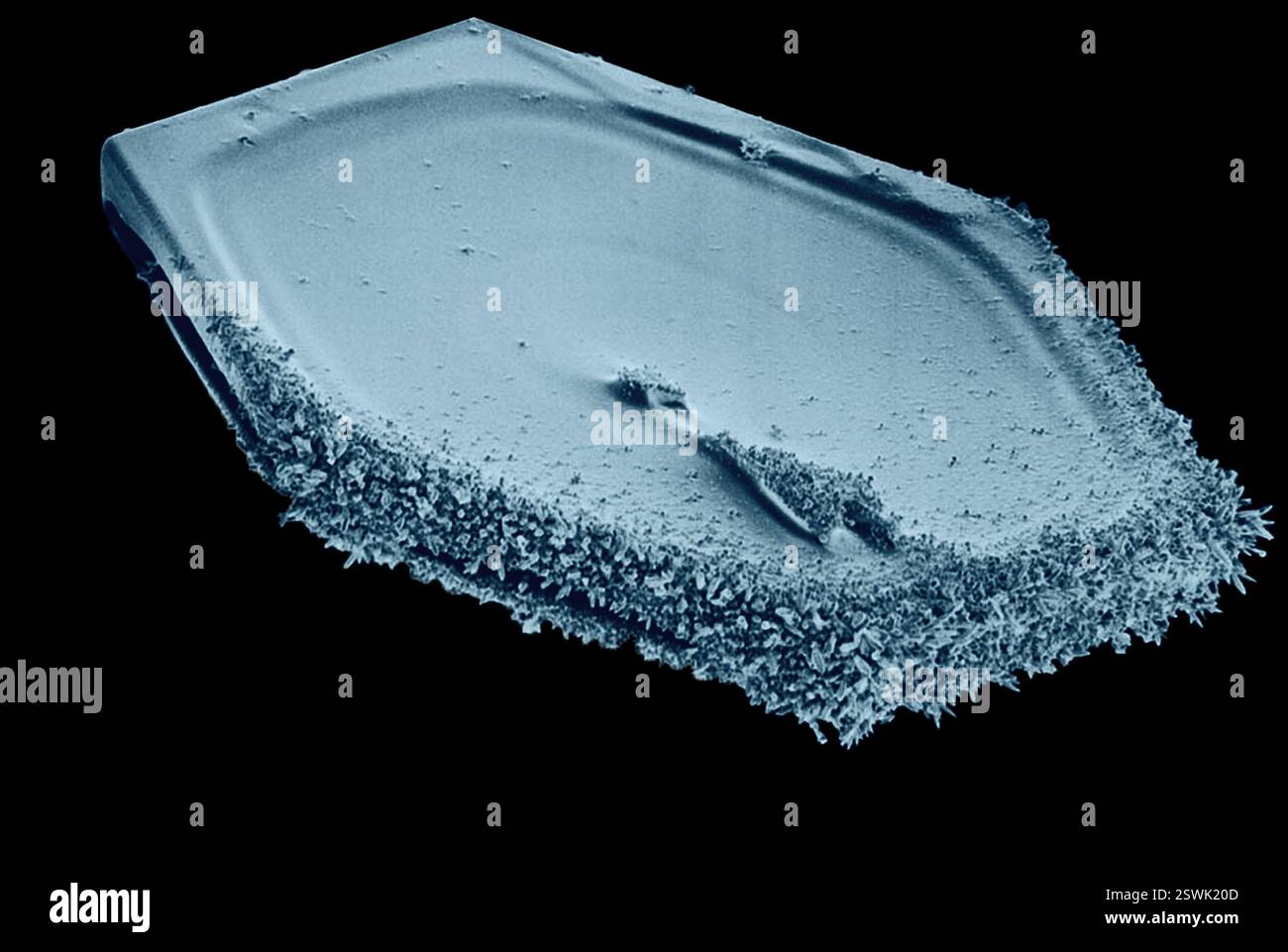 Rimed hexagonal snow crystal. Rime is a white ice that forms when the ...