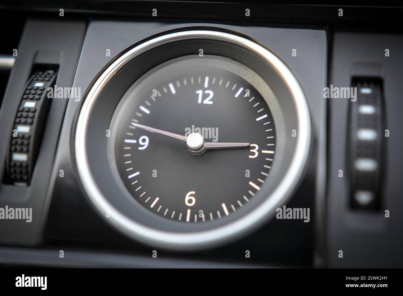 Close up of an analog clock in a vehicle's dashboard Stock Photo - Alamy