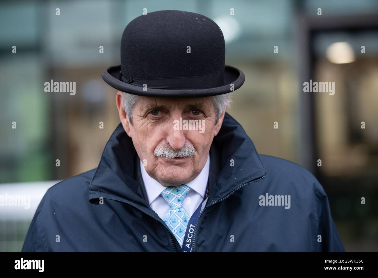 Ascot, Berkshire, UK. 15th February, 2025. Ascot Steward George wears ...