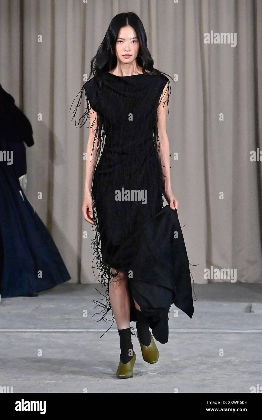 A model walks on the runway during the Mithridate Ready to Wear Fashion ...