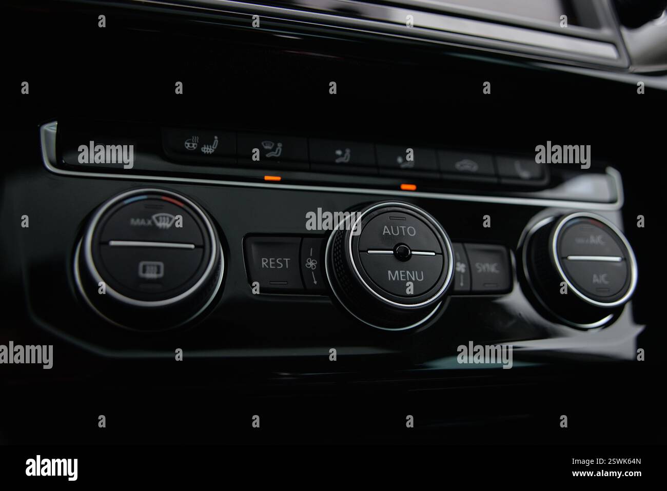 Modern car climate control panel with buttons and dials for temperature ...