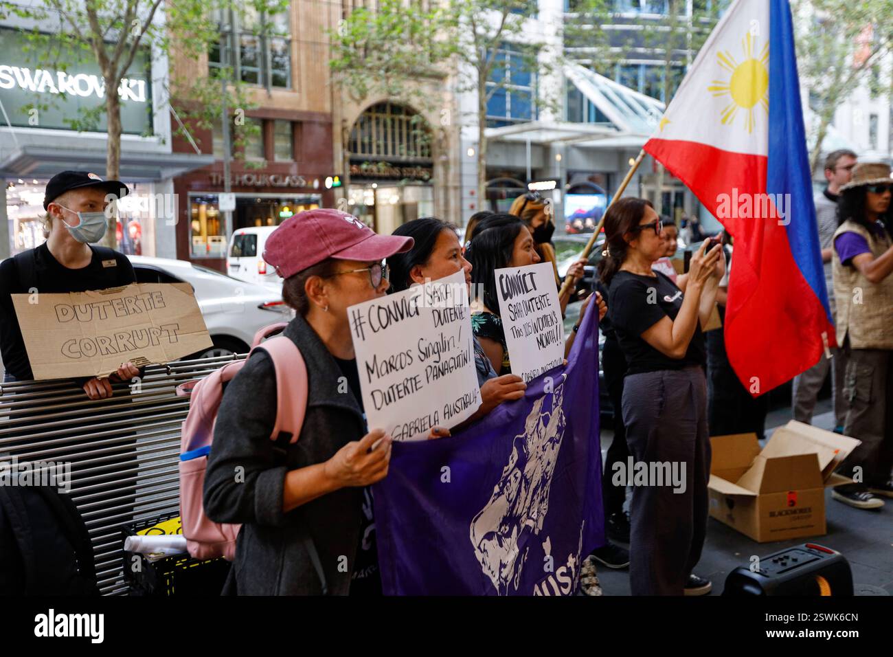 Protesters hold placards during the Black Friday protest. Protesters ...