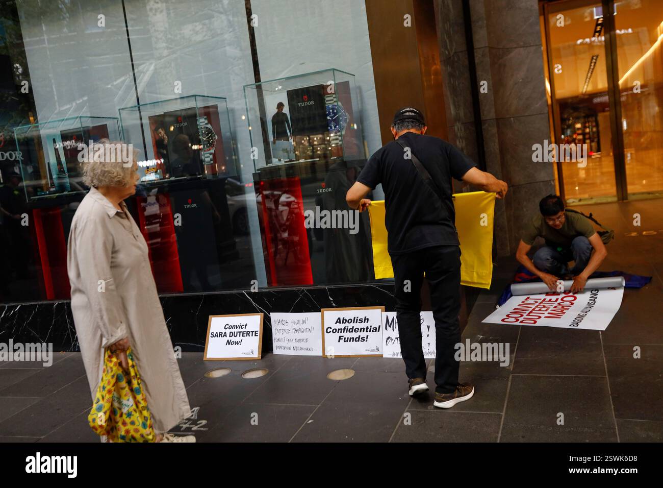A man seen looking at protest placards during the Black Friday protest ...