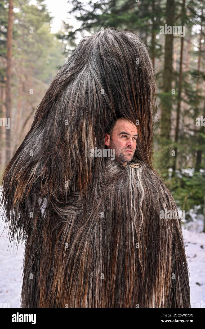 Traditional Kukeri performers dressed in thick long hair goat fur ...