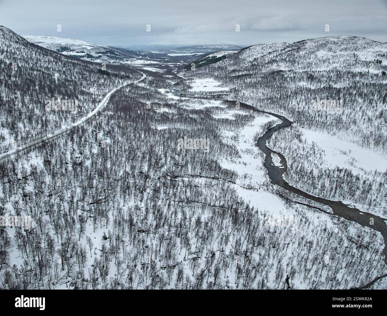flight over a country road in the snowy highland tundra landscape of ...