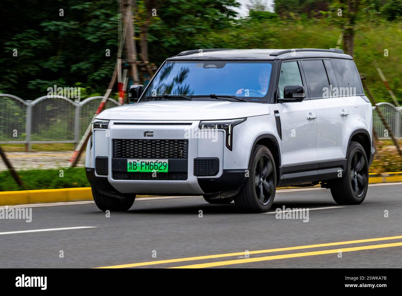 A Rox 01 extended range EV being driven on a test drive in Shanghai ...