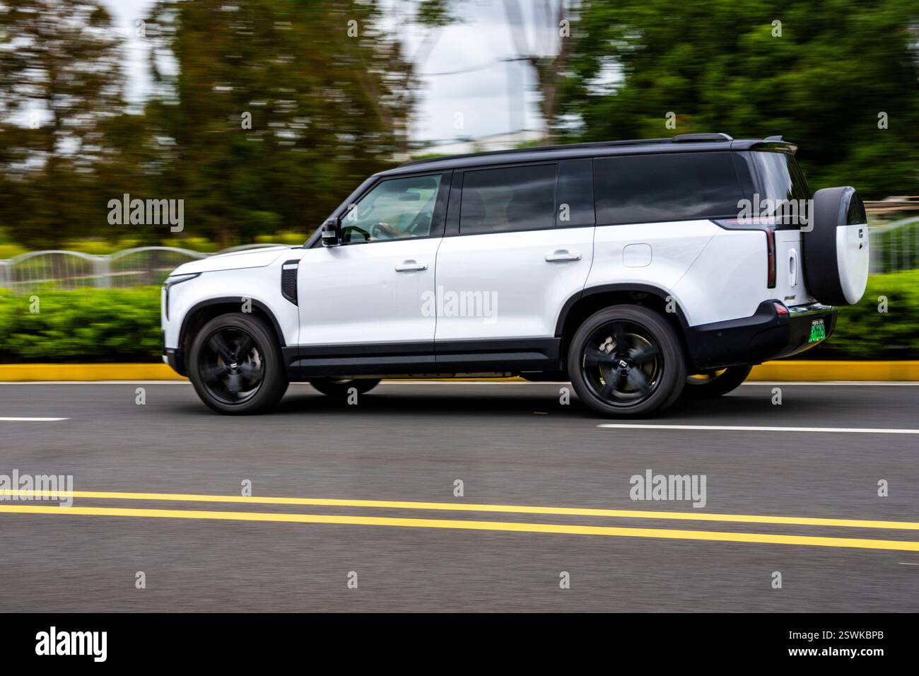 A Rox 01 extended range EV being driven on a test drive in Shanghai ...