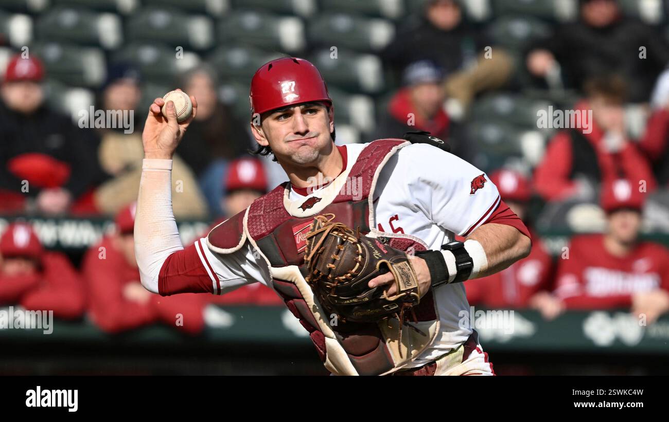 Arkansas catcher Ryder Helfrick (27) makes a throw to first base ...