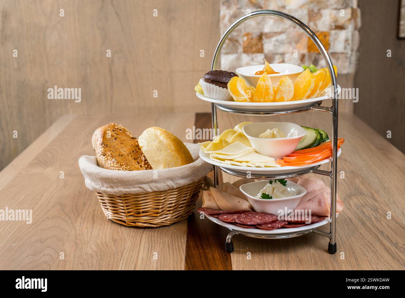 Assorted breakfast platter with pastries fruit cheese and meat ...