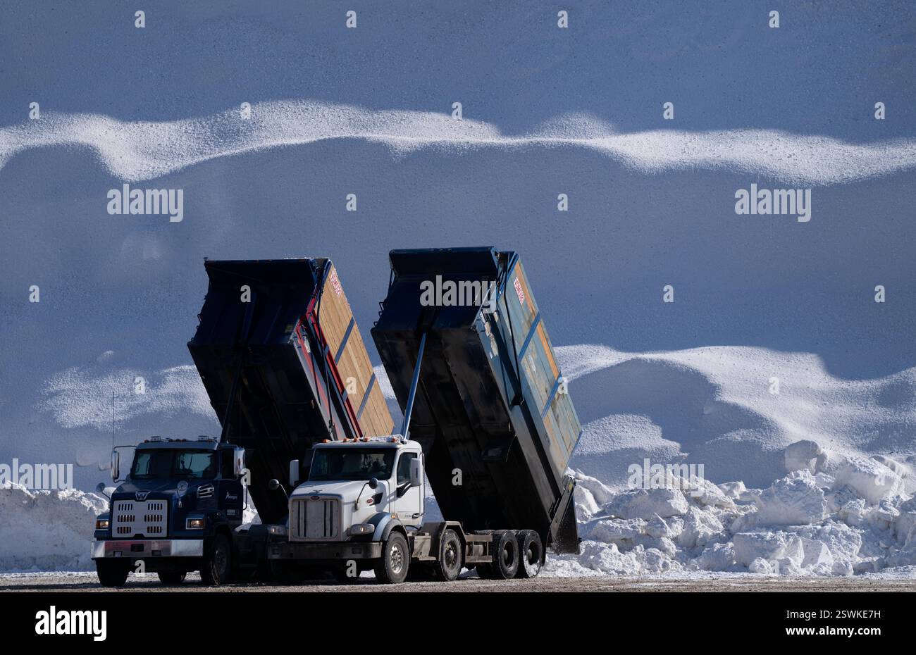 Montreal, Canada. 21st Feb, 2025. Trucks drop off loads of snow at the ...