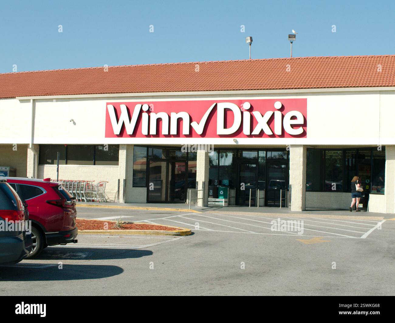 View from the parking lot of a Winn Dixie Grocery store. Multiple cars ...