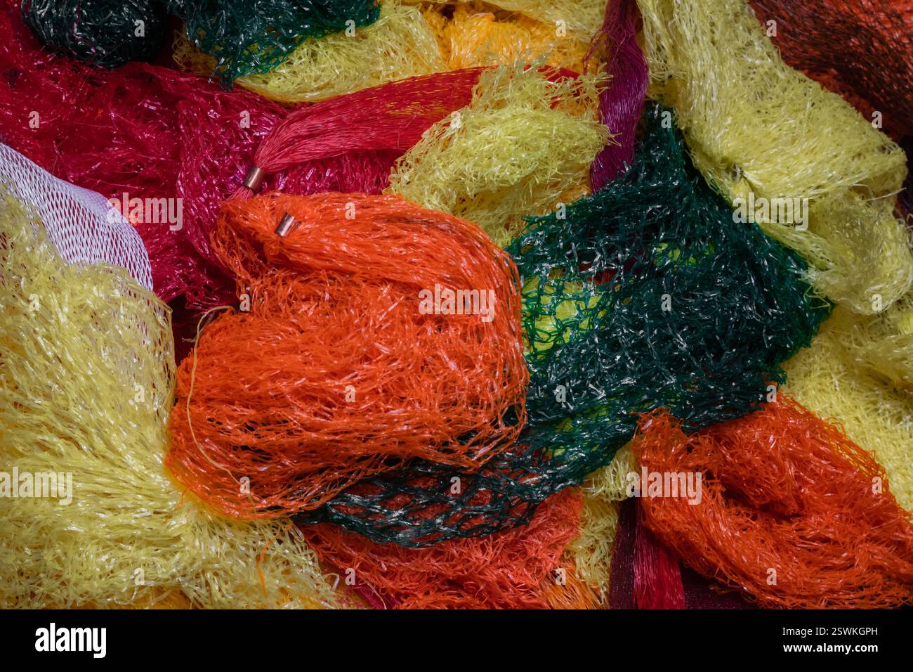 Colorful abstract image with various empty mesh bags, mini grocery net ...