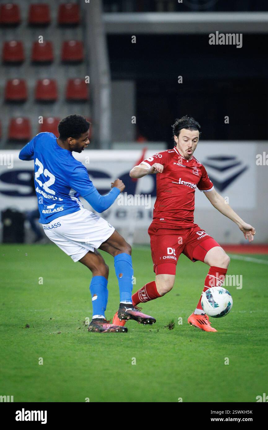 Waregem, Belgium. 21st Feb, 2025. Genk's Brad Ryan Manguelle and Essevee's Youssef Challouk ...