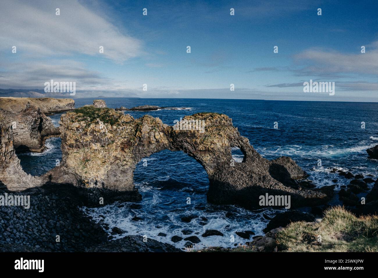 Gatklettur, the natural stone arch at Arnarstapi, Snæfellsnes Peninsula ...