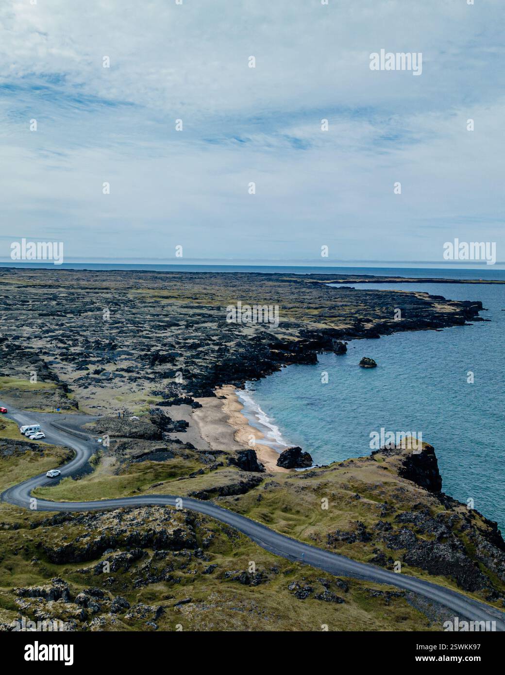 Skarðsvík Beach, a golden sand beach surrounded by volcanic lava cliffs ...