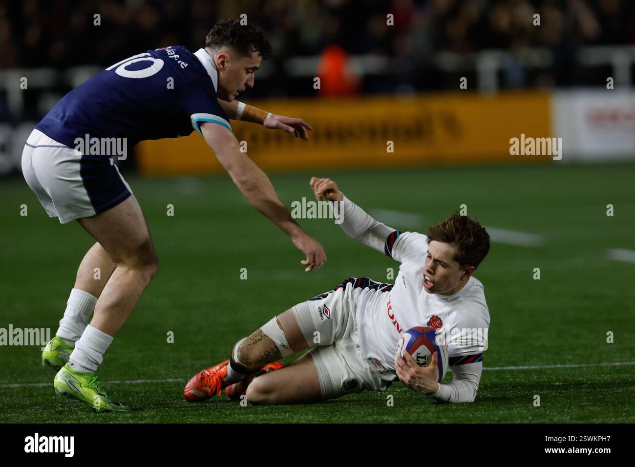 Matthew Urwin of Scotland U'20's tackles Lucas Friday of England U20's ...