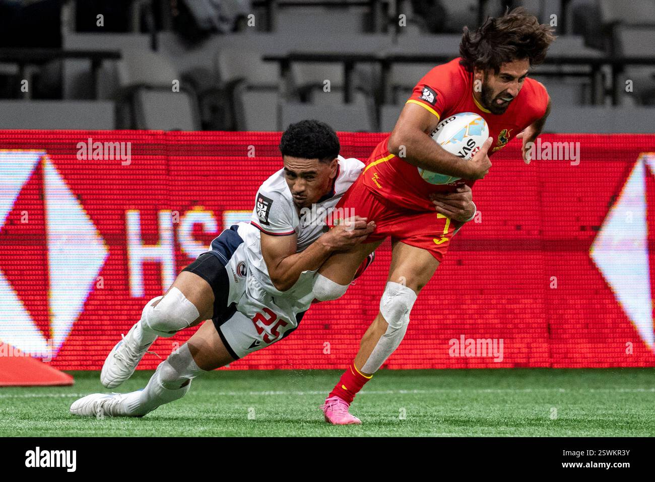 United States' Pita Vi, left, tackles Spain's Pol Pla during a ...