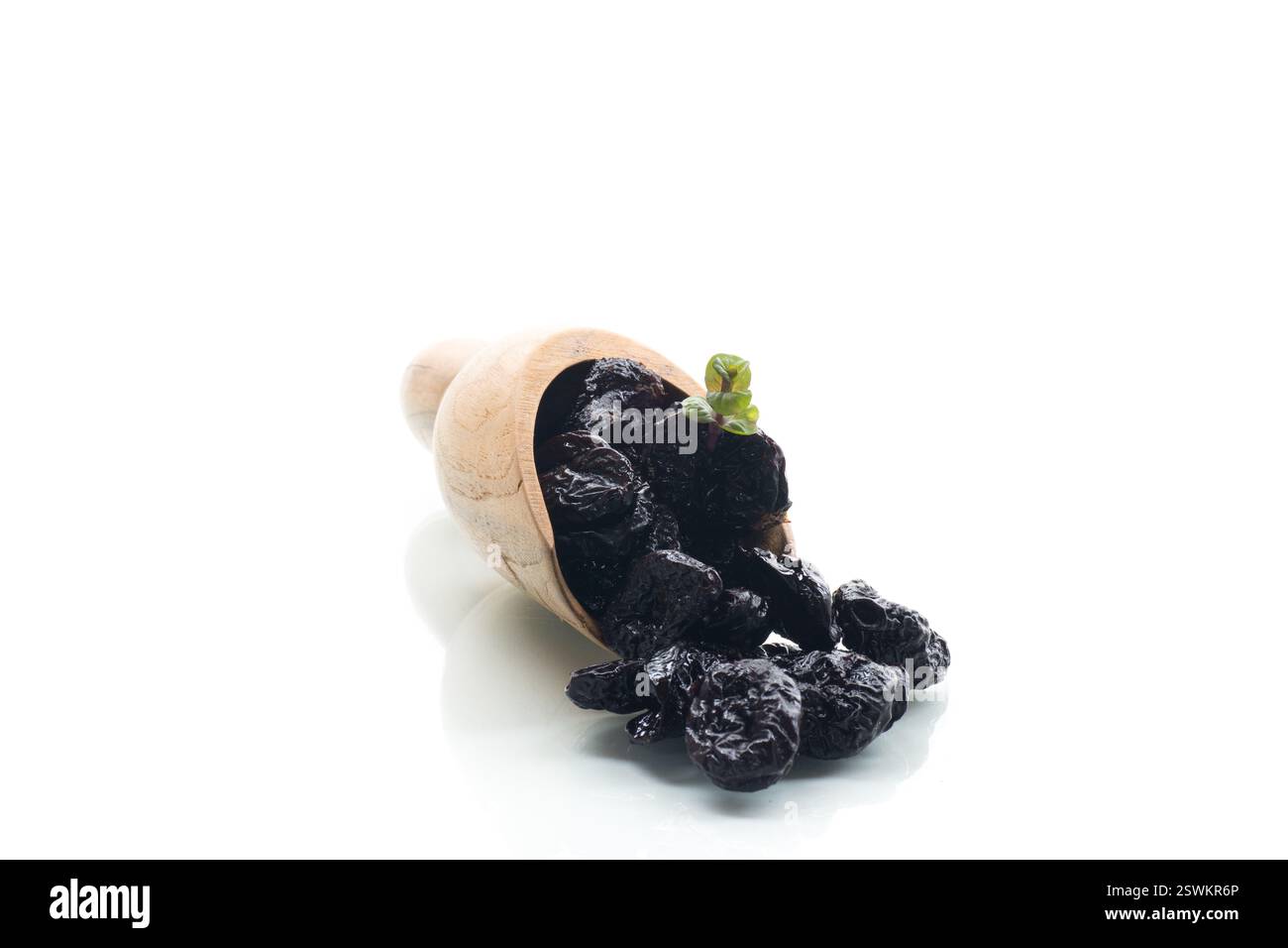 Natural prunes as a healthy source of energy, isolated on a white ...