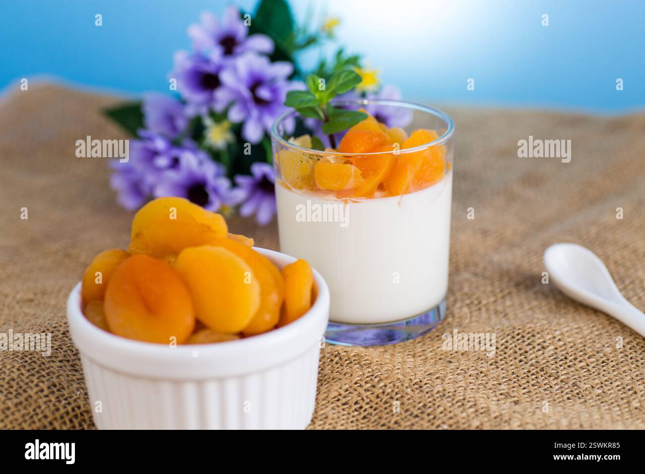 Light fruit yogurt with dried apricots and mint Stock Photo - Alamy