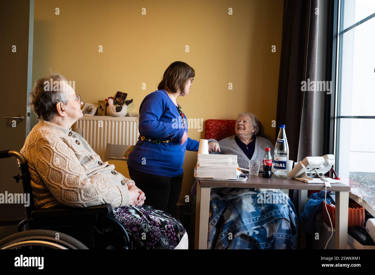 86 and 95 yo woman in a wheelchair, with a 42 yo woman with the Down ...