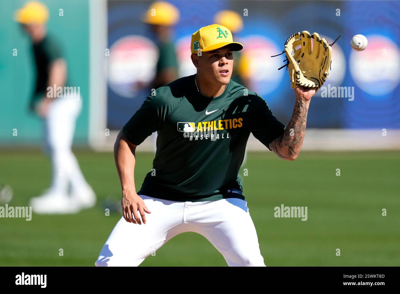 Athletics' Gio Urshela runs drills during a spring training baseball ...