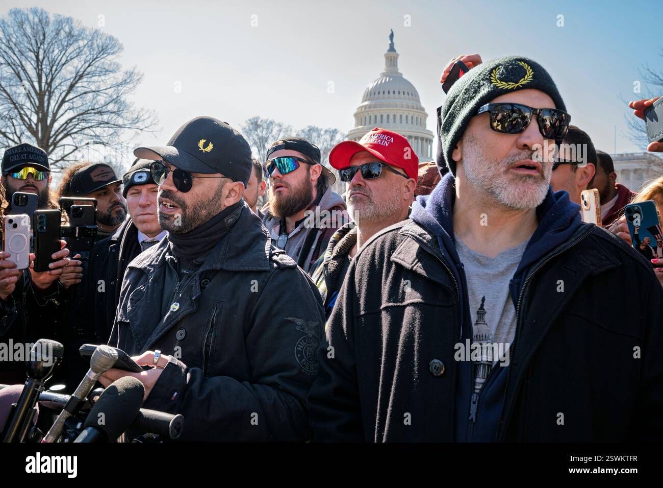 Former Proud Boys leader Enrique Tarrio, left, speaks during a news ...